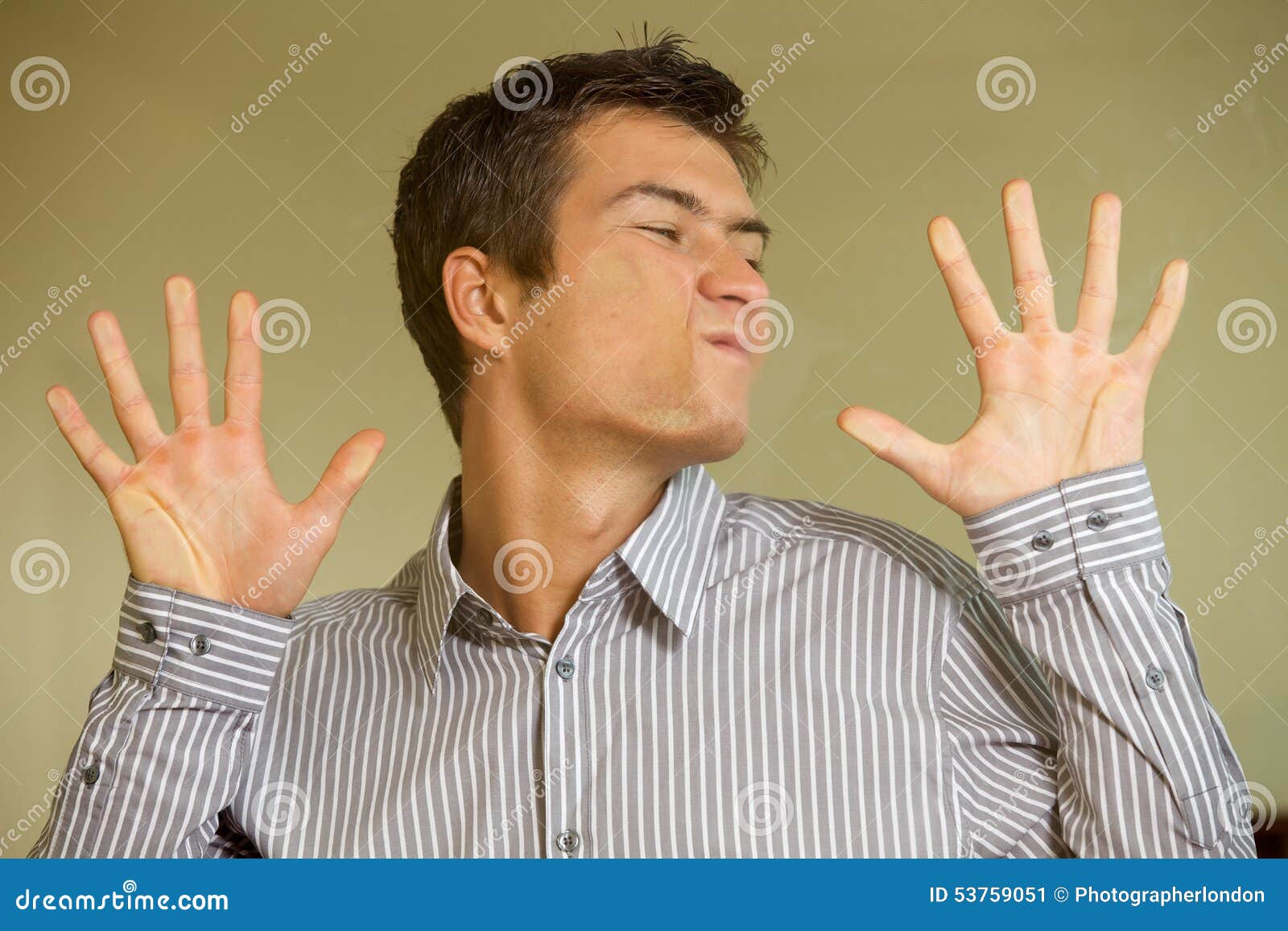 Young Man Making Face on Glass Wall Stock Image - Image of view, color ...