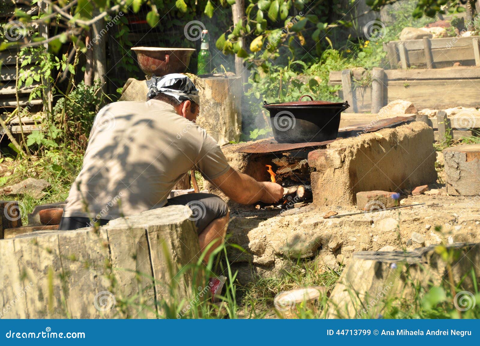 Young Man Making Fire for Cooking Outside Stock Image - Image of ...