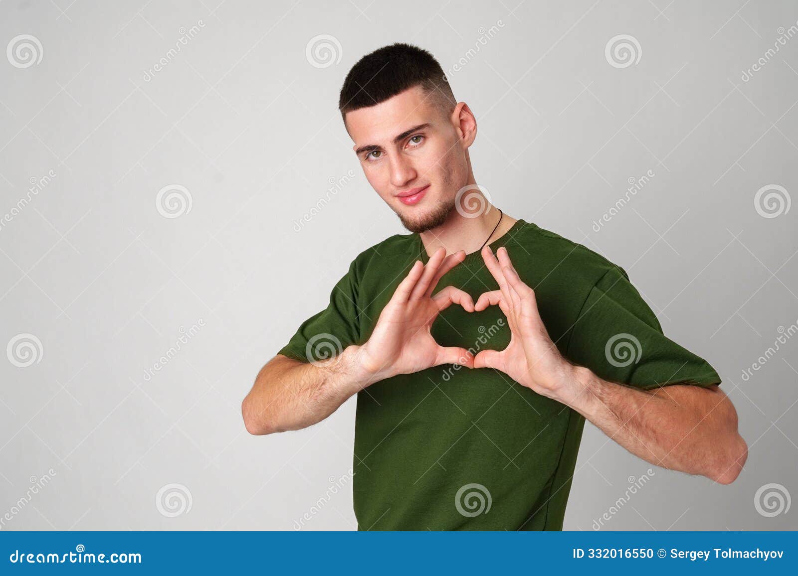 Young Man Making Heart Shape with Hands in Front of White Background ...