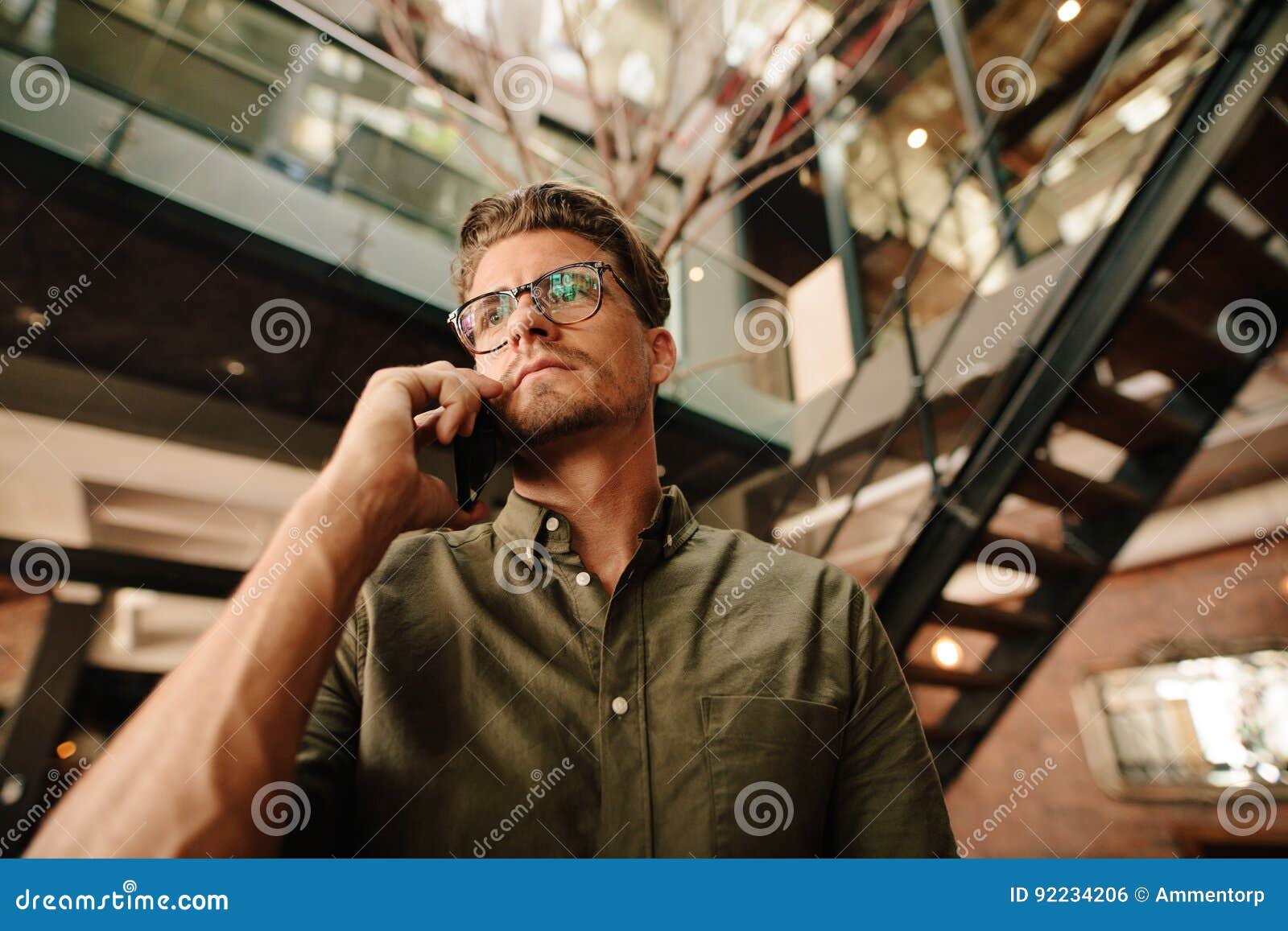 Young Man Making a Phone Call Stock Photo - Image of office, phone ...