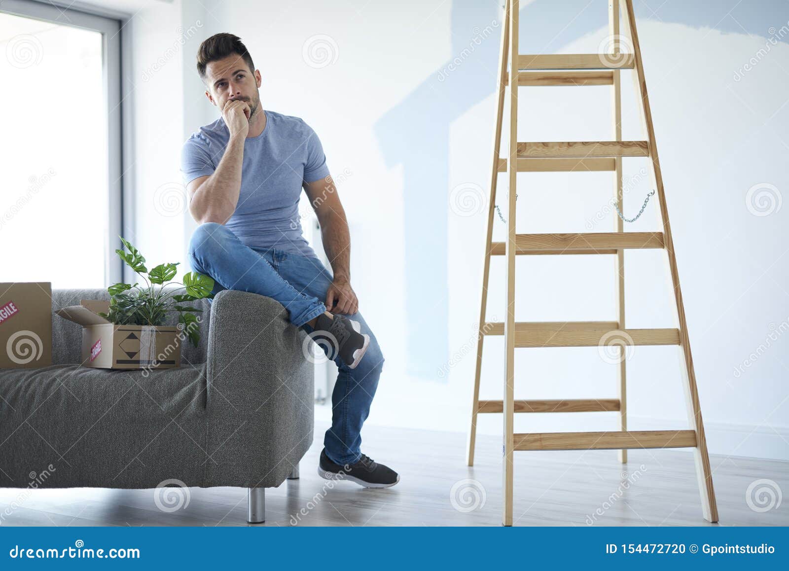 Young Man Making Plans for His New Flat Stock Photo - Image of making ...