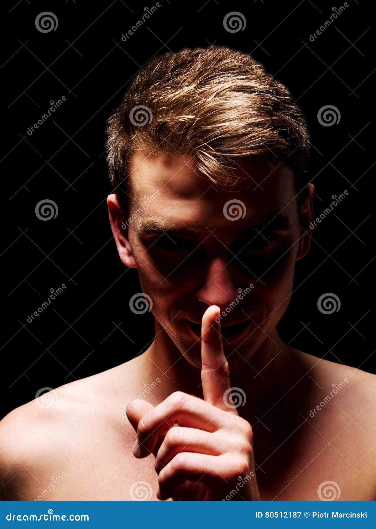 Young Man Making Silence Gesture Stock Image - Image of glad, adult ...