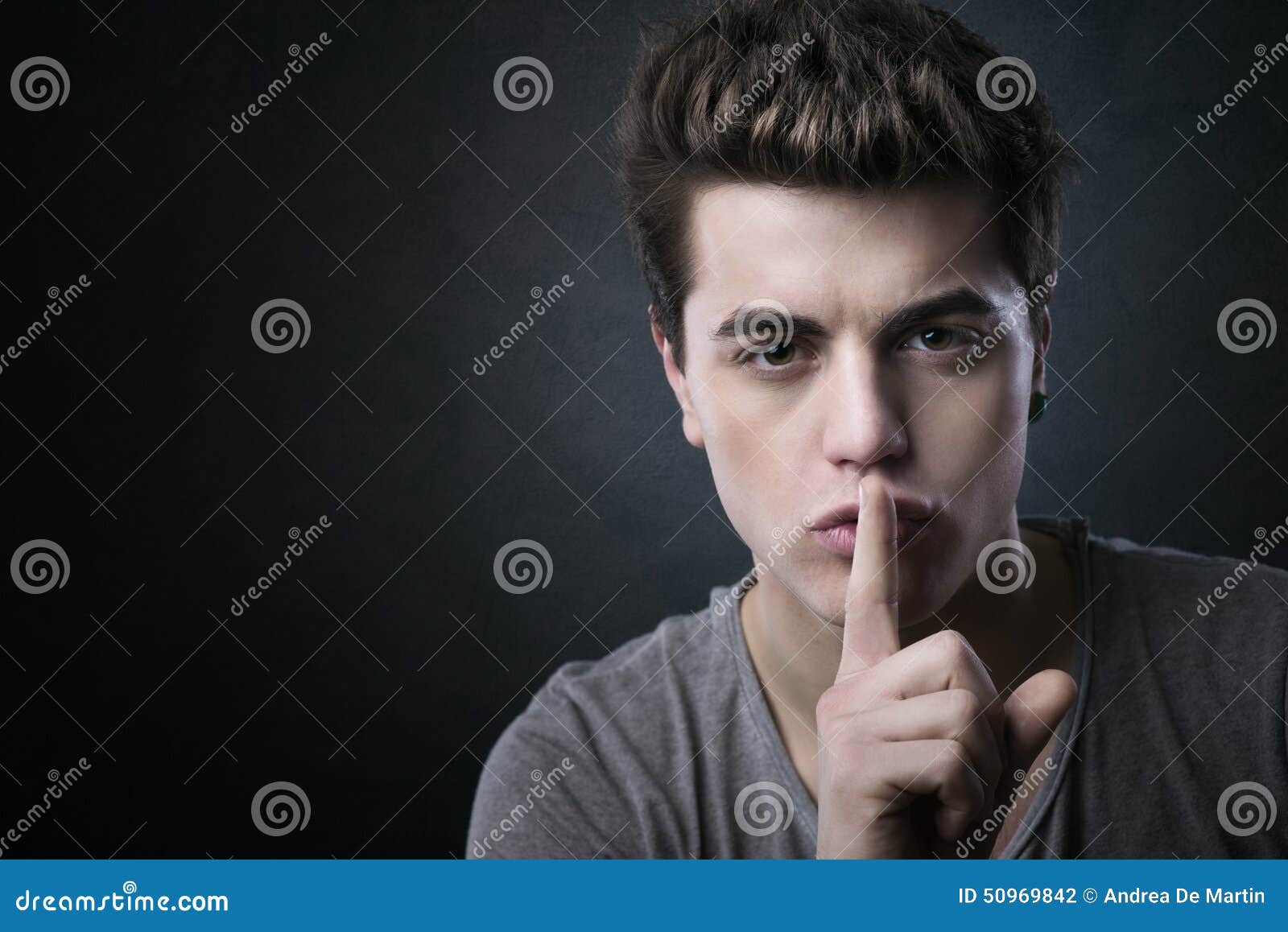 Young Man Making Silence Gesture Stock Photo - Image of portrait ...
