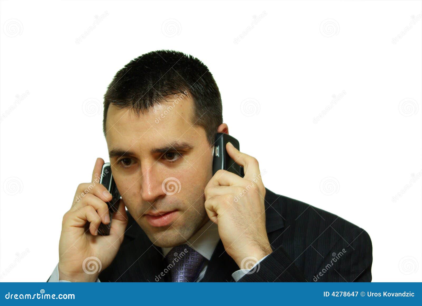 Young man making two calls stock image. Image of people - 4278647