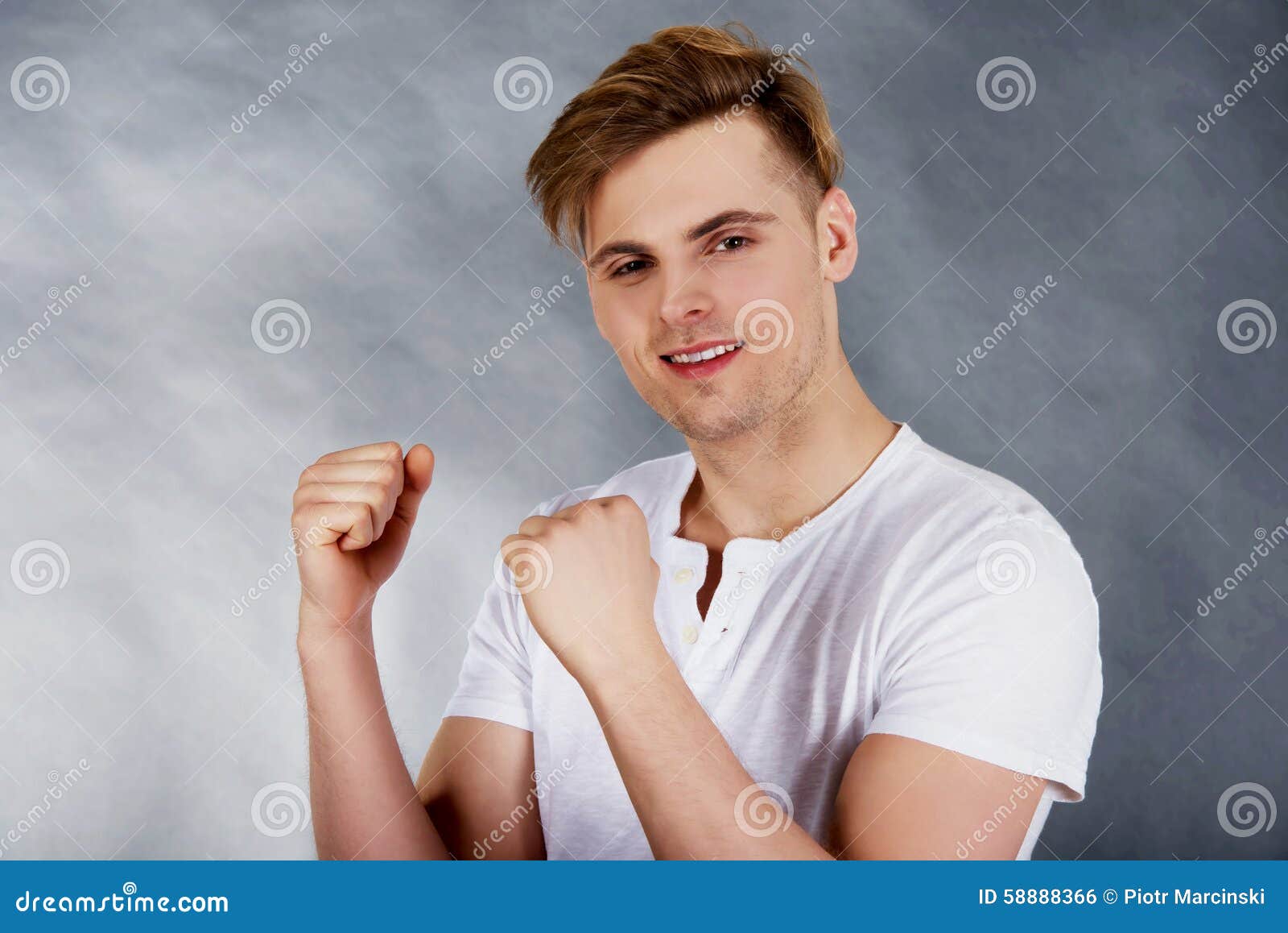 Young man making a wish. stock photo. Image of casual - 58888366