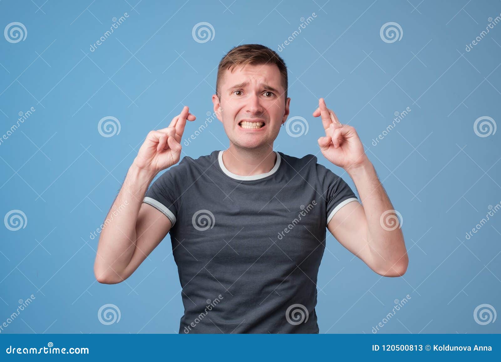Young Man Making a Wish Isolated on Blue Background Stock Image - Image ...