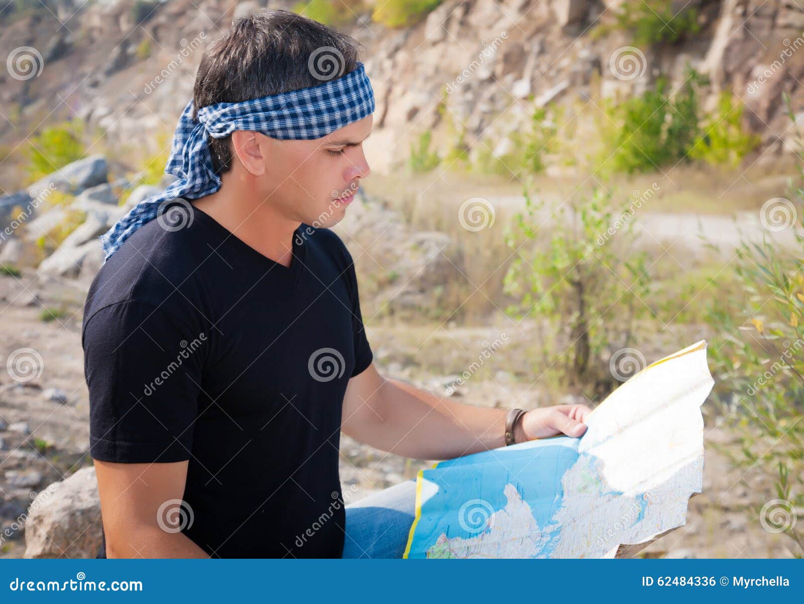 Young man with a map stock photo. Image of adventure - 62484336