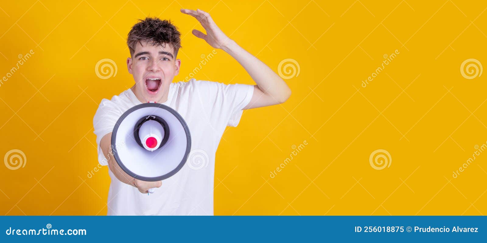 Young man with megaphone stock image. Image of message - 256018875