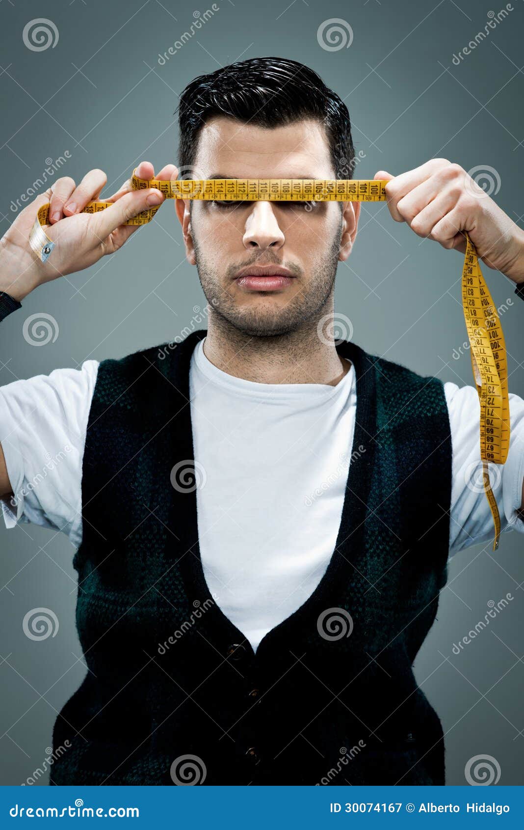Young Man with a Metre Rule in Front of His Face Stock Image - Image of ...