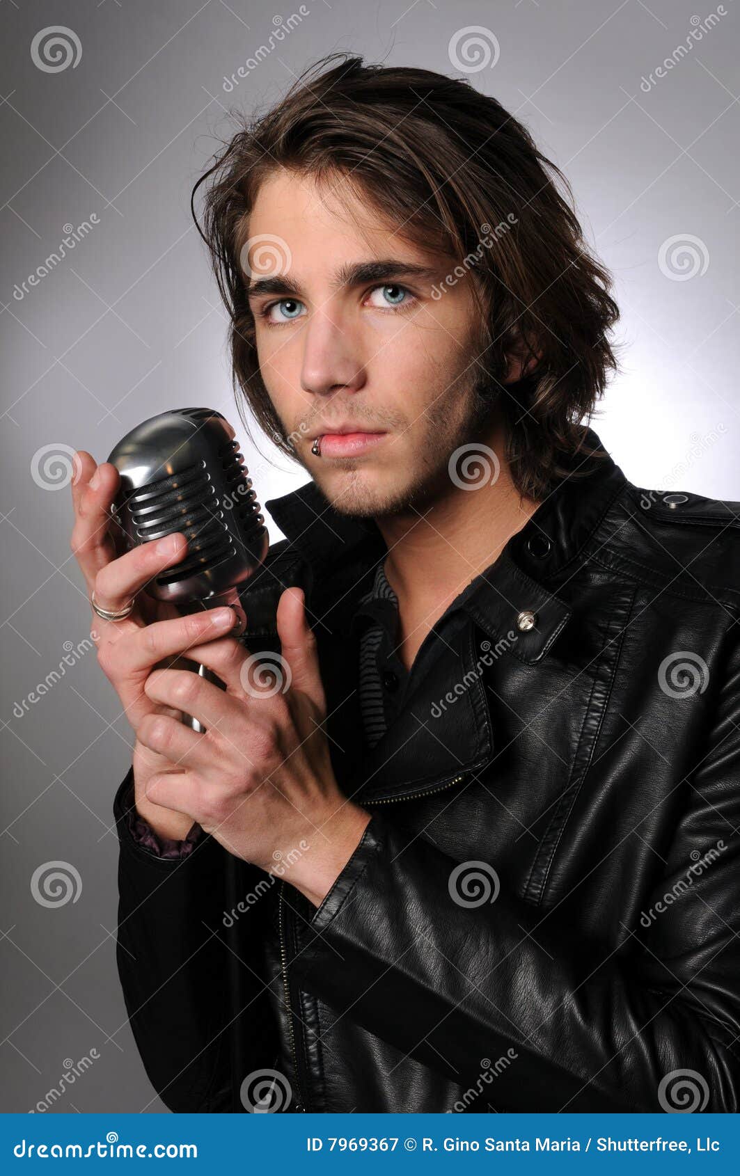 Young Man with Microphone stock image. Image of microphone - 7969367
