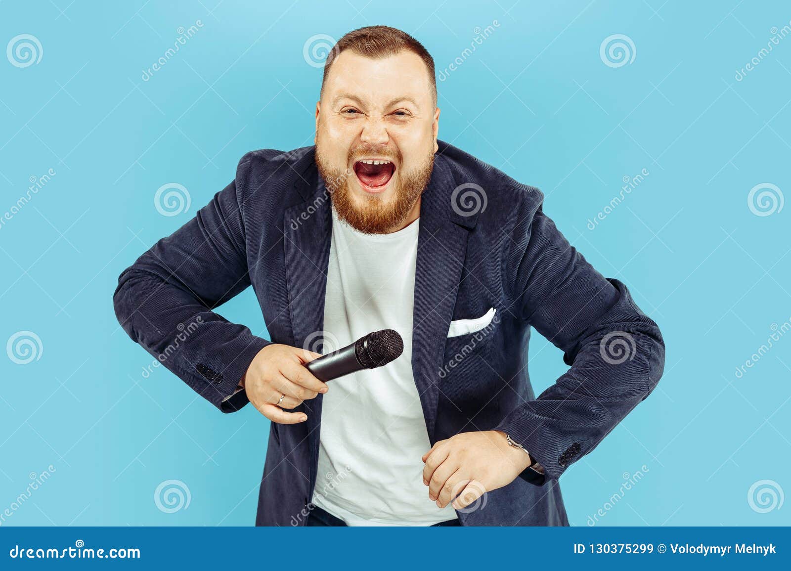 Young Man with Microphone on Blue Background, Leading Concept Stock ...
