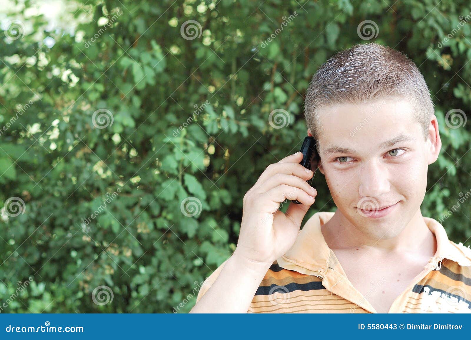 Young Man with Mobile Phone Stock Image - Image of cell, teen: 5580443