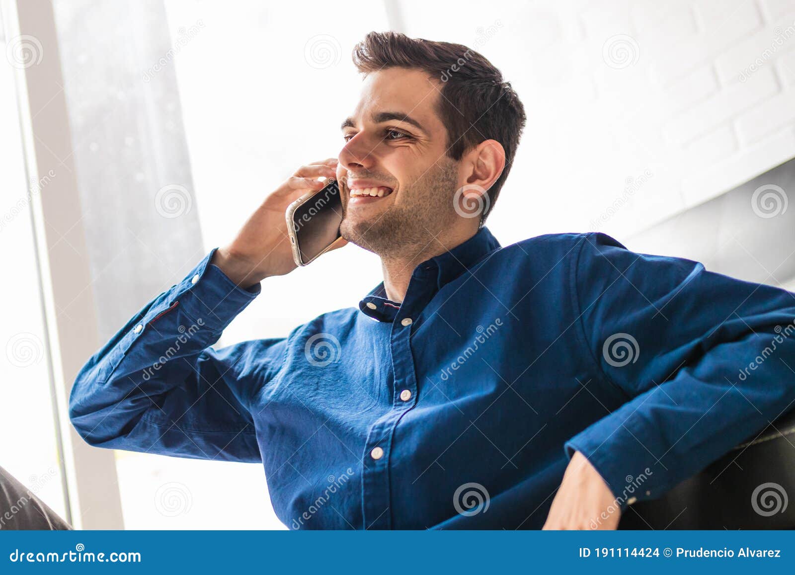 Young Man with Mobile Phone Stock Photo - Image of mobile, interior ...