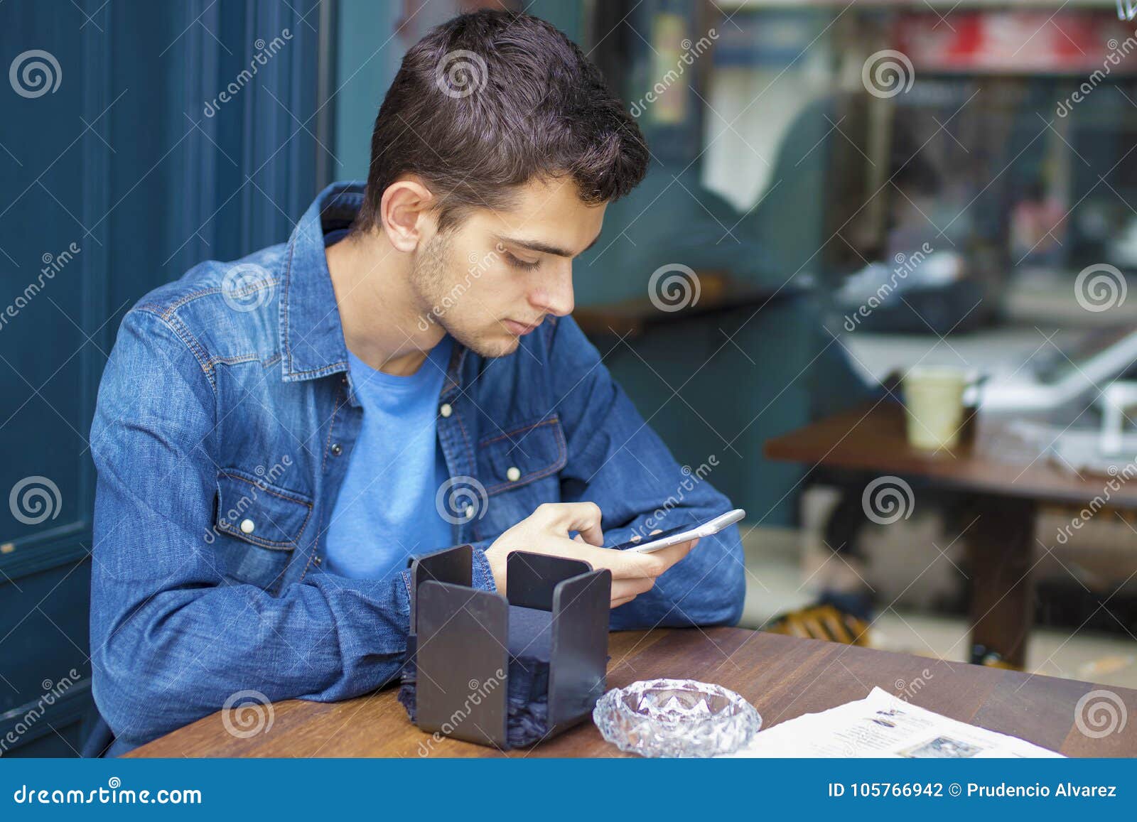 Young Man with Mobile Phone on Terrace Stock Photo - Image of ...