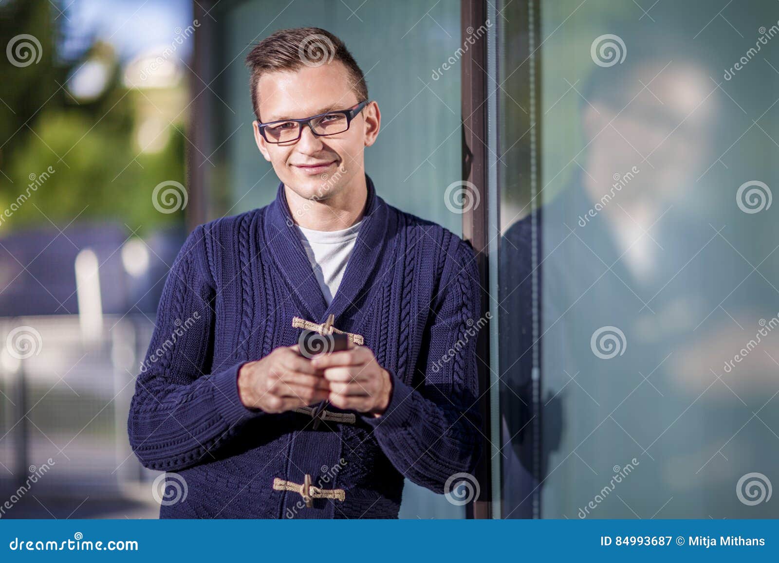 Young Man with Mobile Phone Stock Image - Image of eyes, looking: 84993687