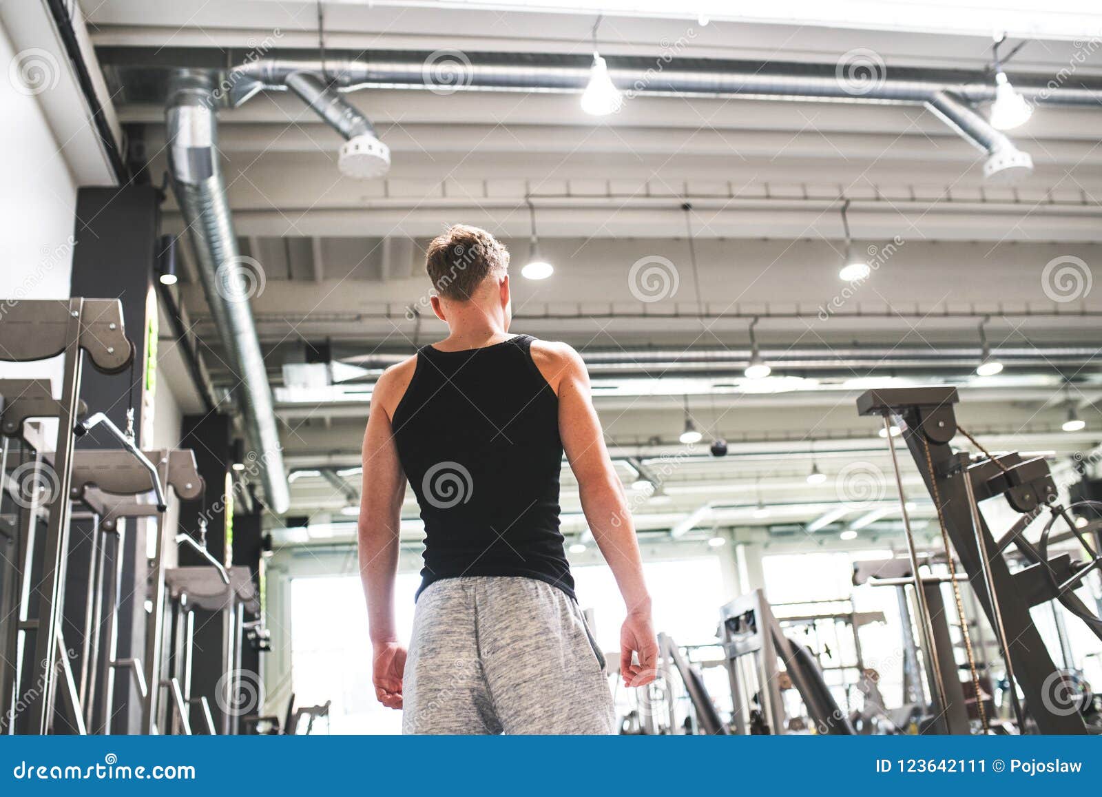 Young Man in Modern Crossfit Gym, Standing. Rear View Stock Image ...