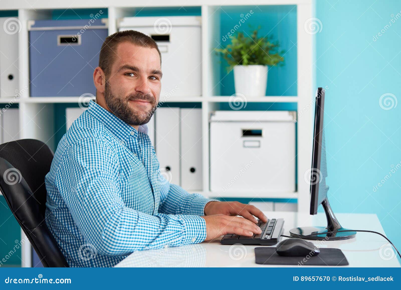 Young man in modern office stock photo. Image of businessman - 89657670