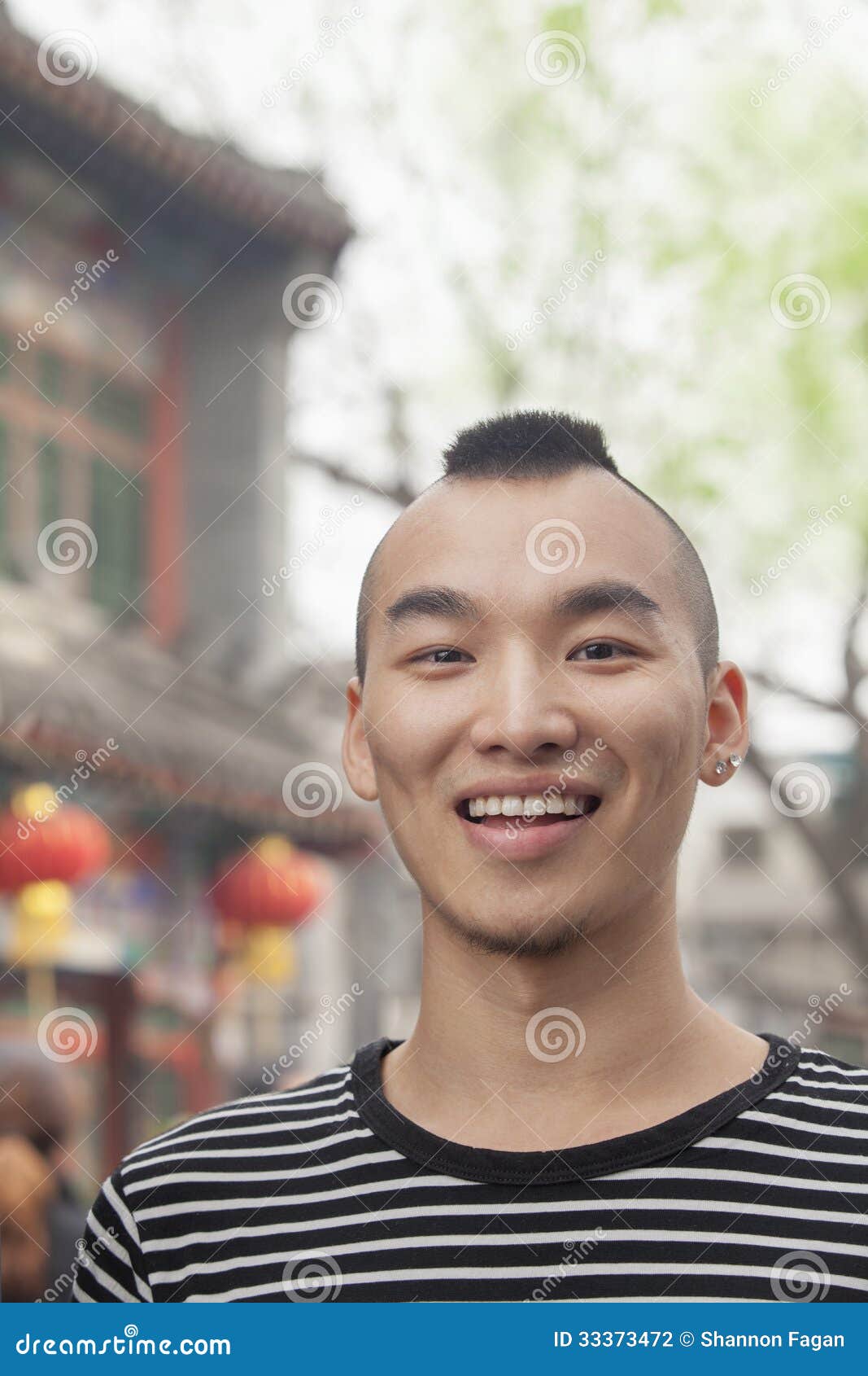 Young Man with Mohawk Haircut Smiling Looking at Camera Stock Photo ...
