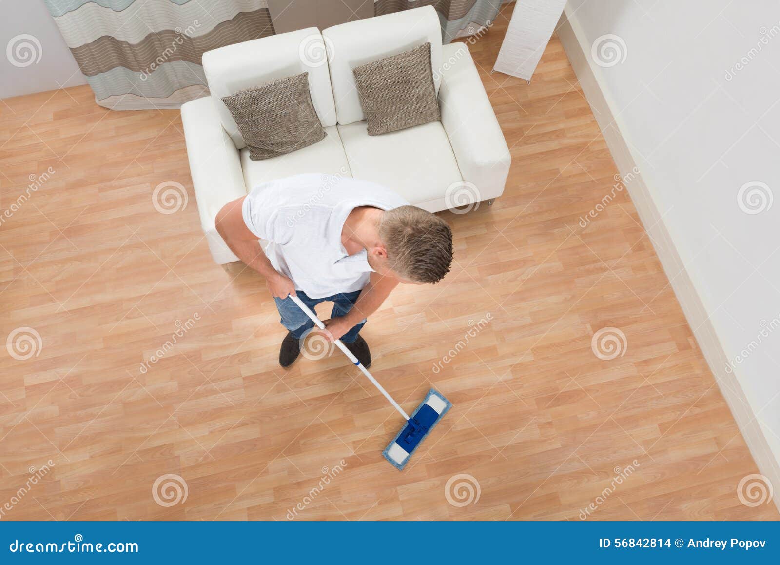 Young Man Mopping Floor stock photo. Image of housework - 56842814