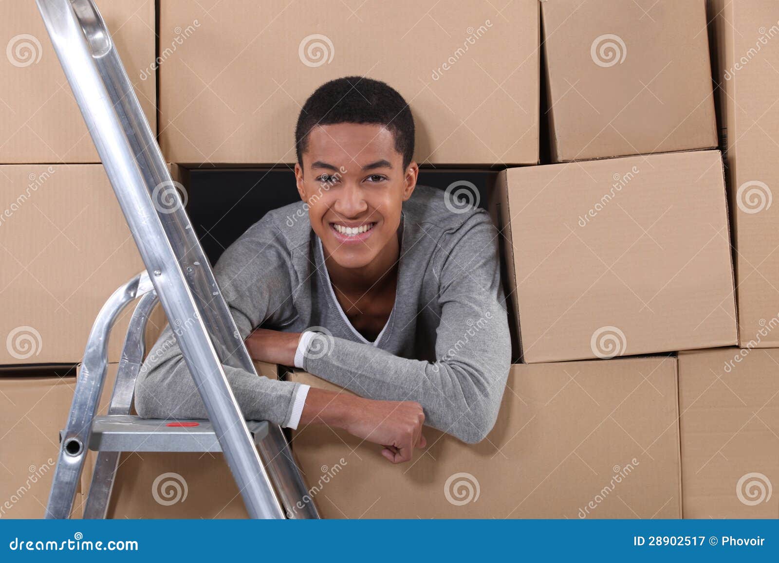Young man on moving day stock image. Image of move, cardboard - 28902517