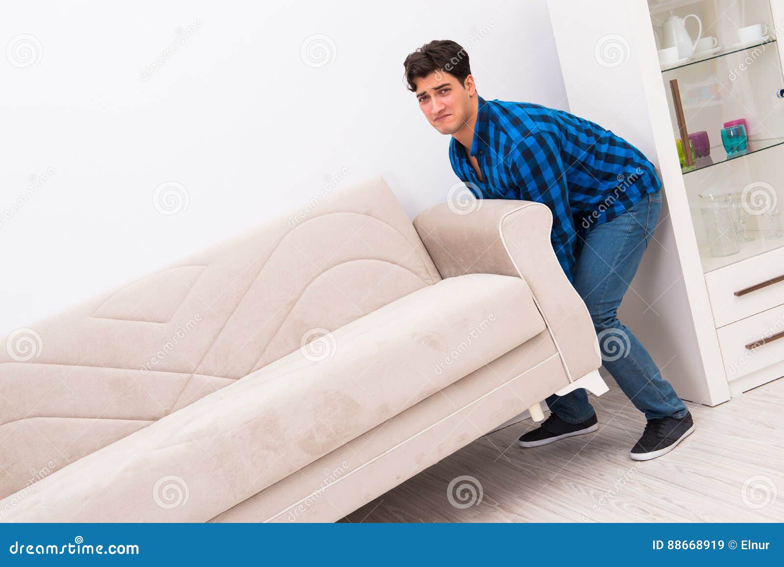 The Young Man Moving Sofa Couch Stock Image - Image of male, occupation ...