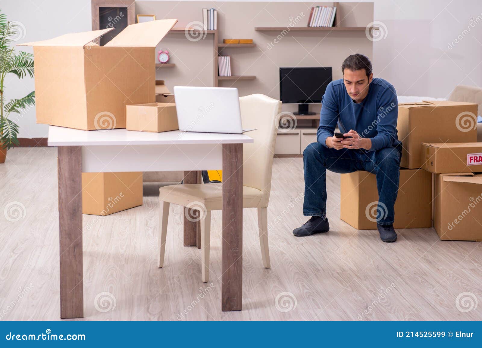Young Man Moving To New Flat Stock Image - Image of apartment, boxes ...