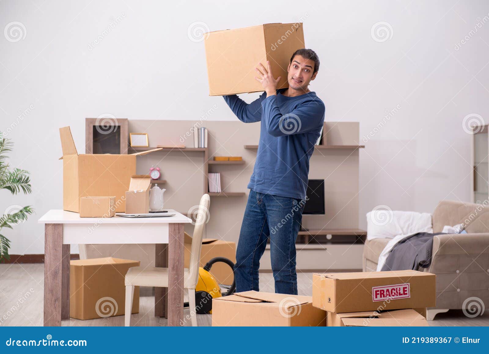 Young Man Moving To New Flat Stock Image - Image of carriage, moving ...