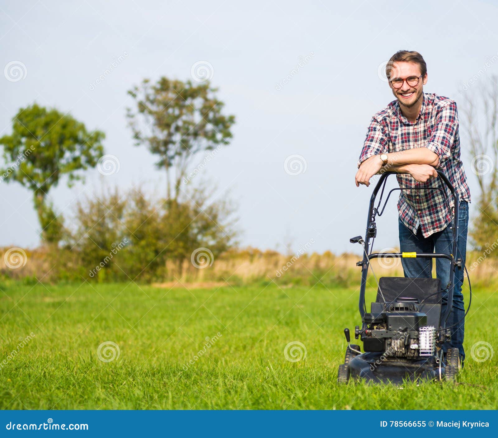 Young man mowing the grass stock image. Image of mowing - 78566655
