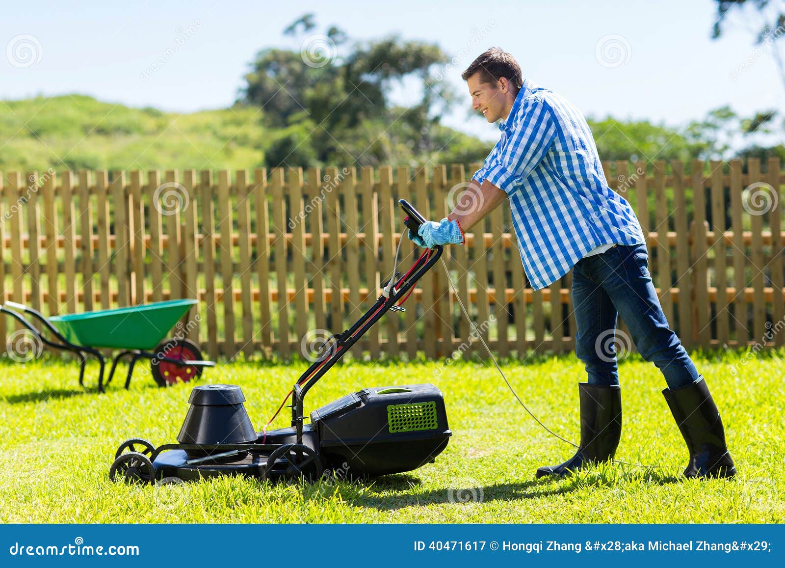 Young man mowing lawn stock image. Image of lawnmower - 40471617