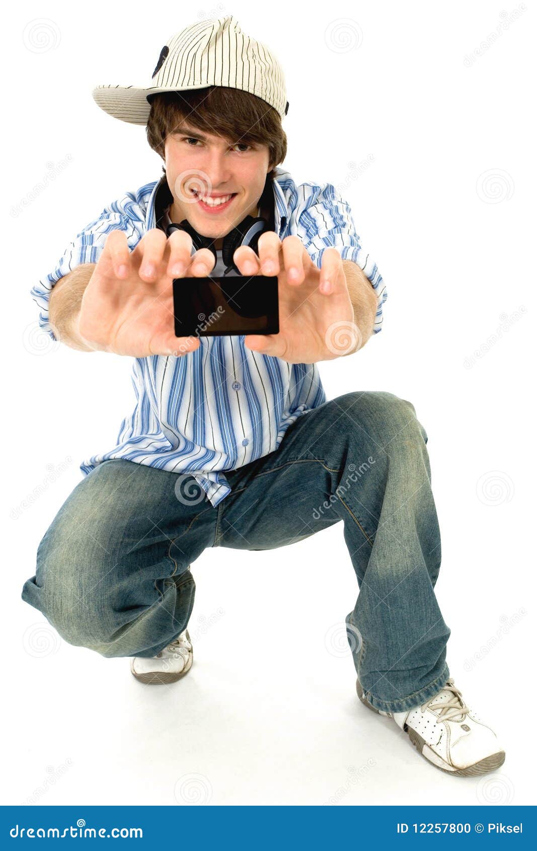 Young man with mp3 player stock photo. Image of player - 12257800
