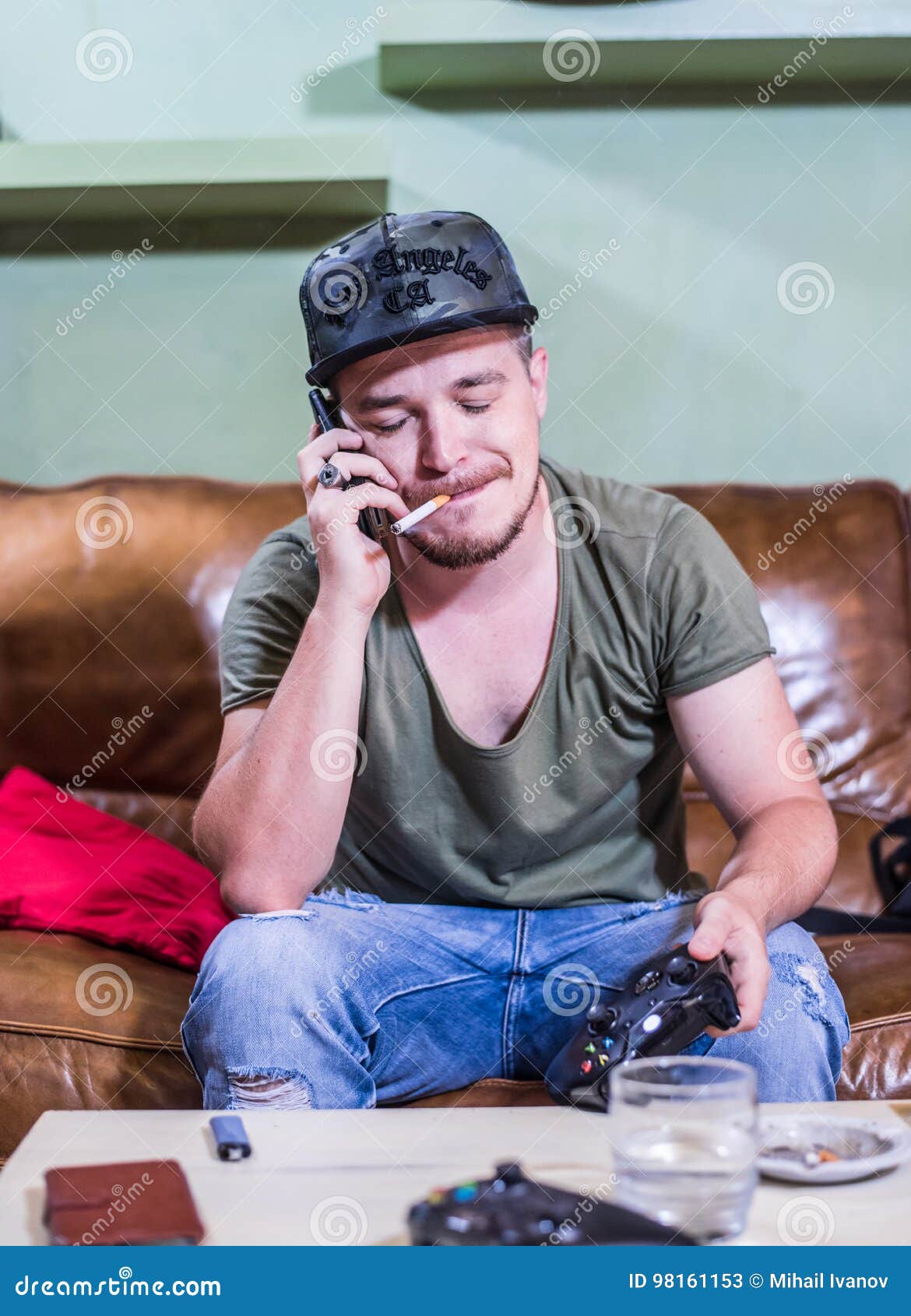 Smoking, Gaming and Using the Cellphone Stock Image - Image of smoking ...
