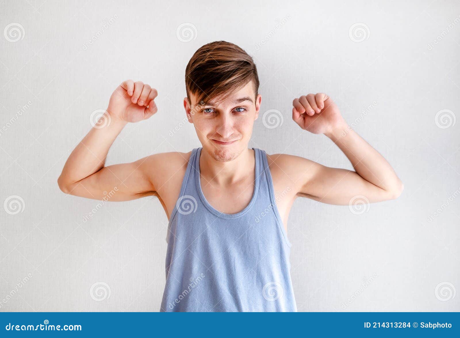 Young Man Muscle Flexing stock photo. Image of fitness - 214313284