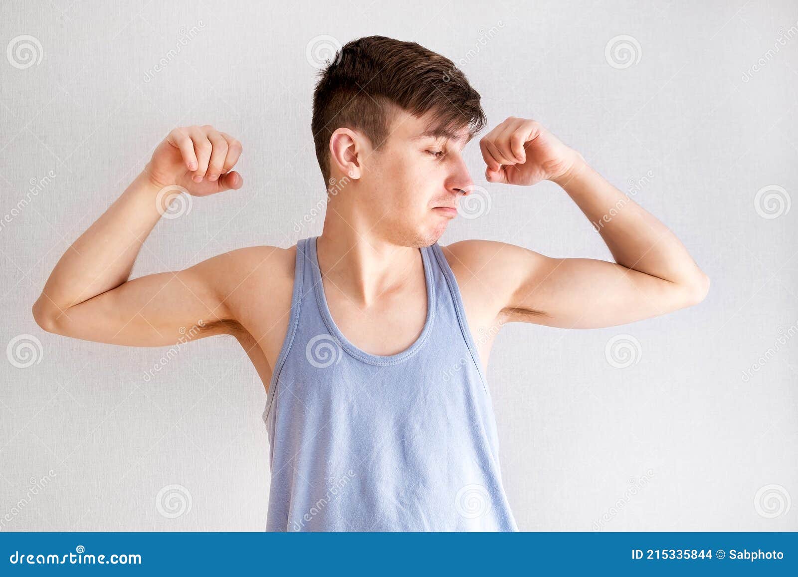 Young Man Muscle Flexing stock photo. Image of health - 215335844