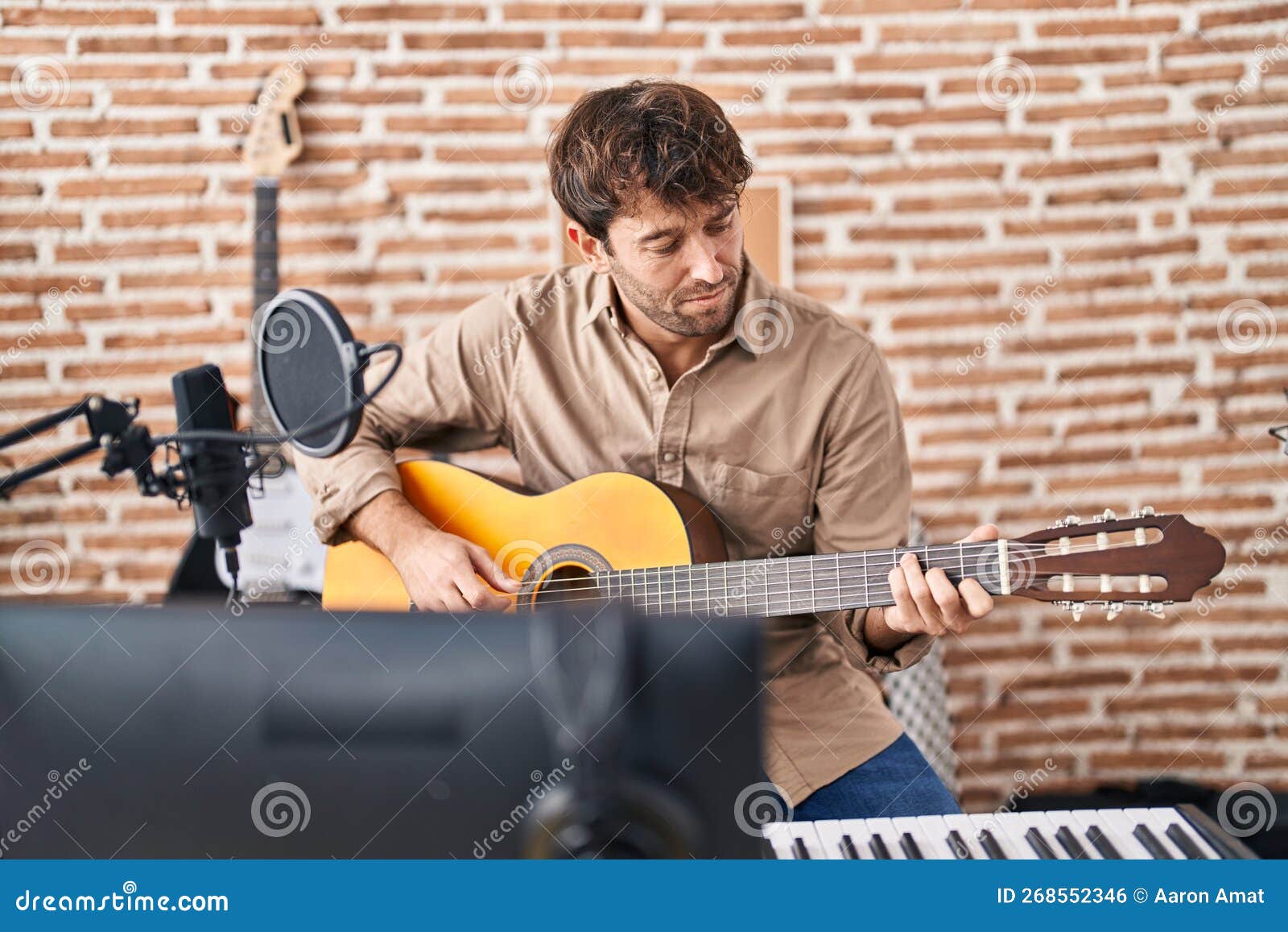 Young Man Musician Playing Classical Guitar at Music Studio Stock Photo ...