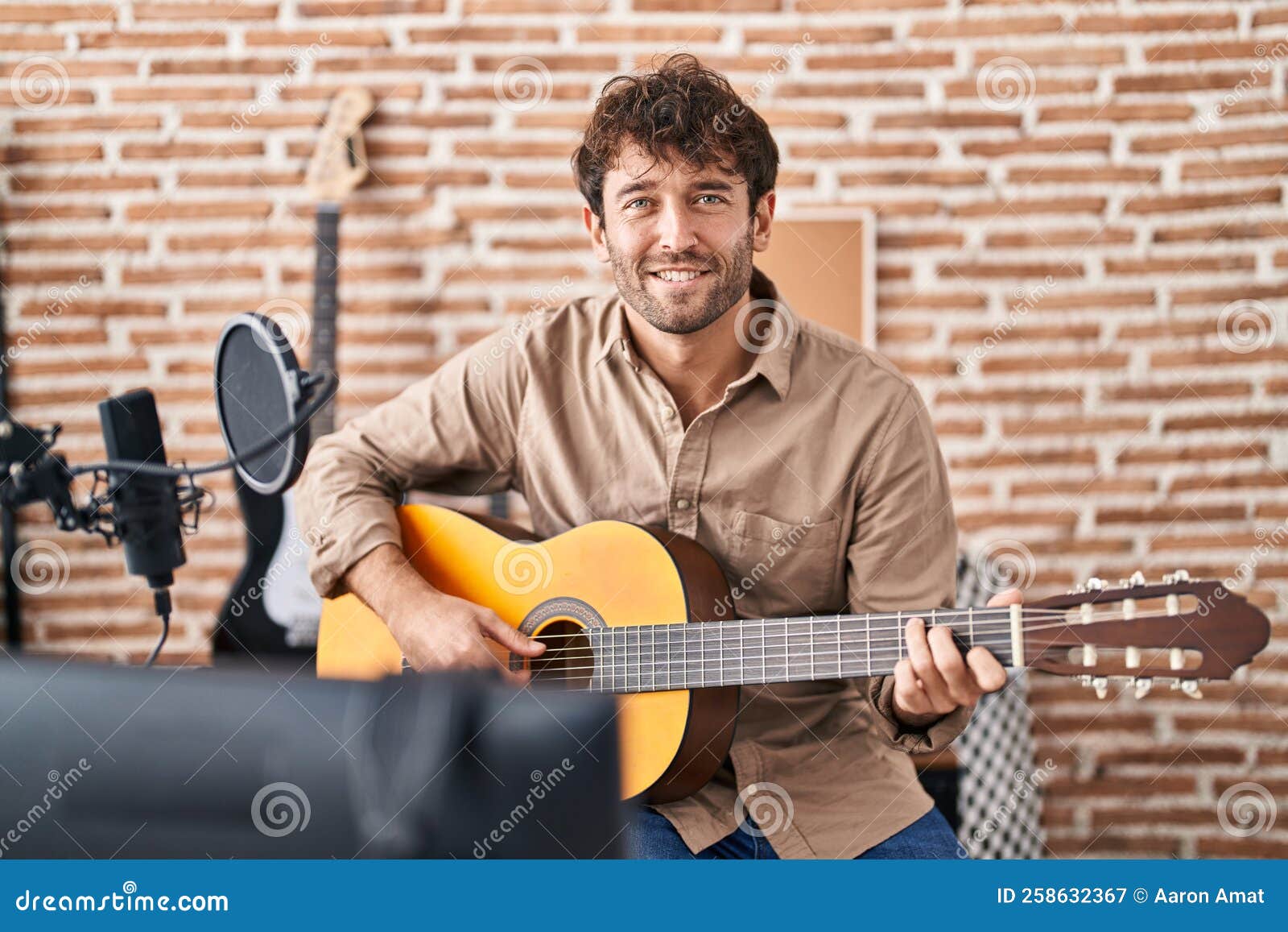 Young Man Musician Smiling Confident Playing Classical Guitar at Music ...