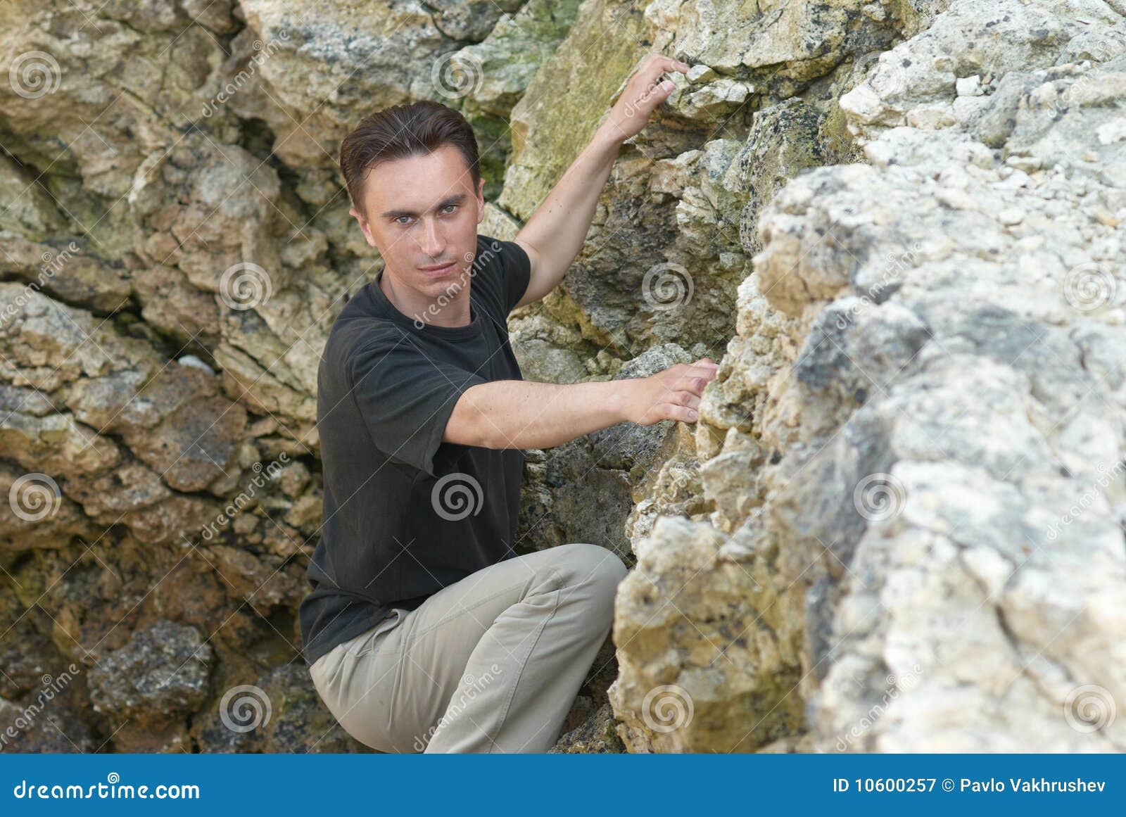 Young man near the rocks stock image. Image of hair, happy - 10600257
