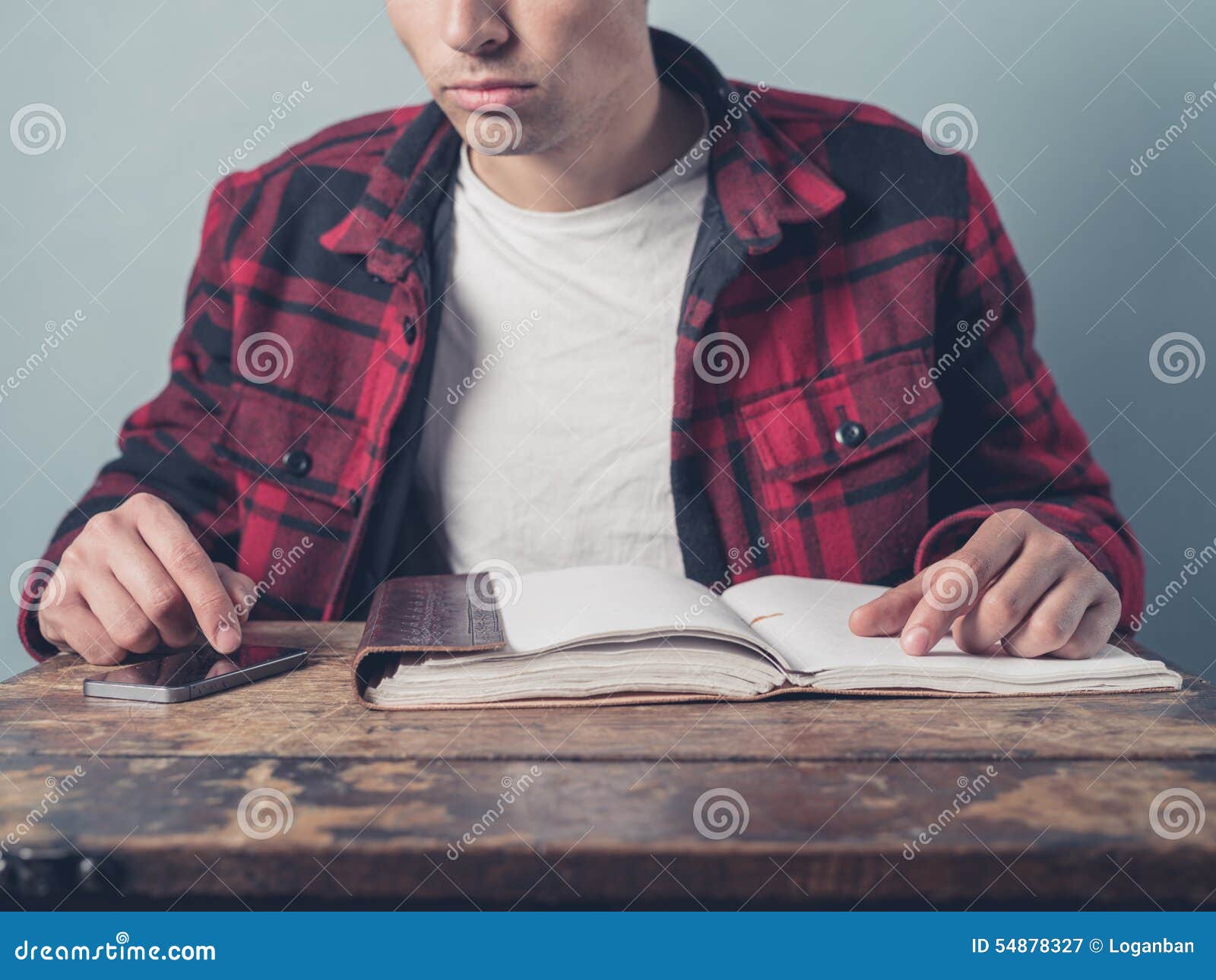 Young Man with Notebook and Smartphone Stock Image - Image of book ...