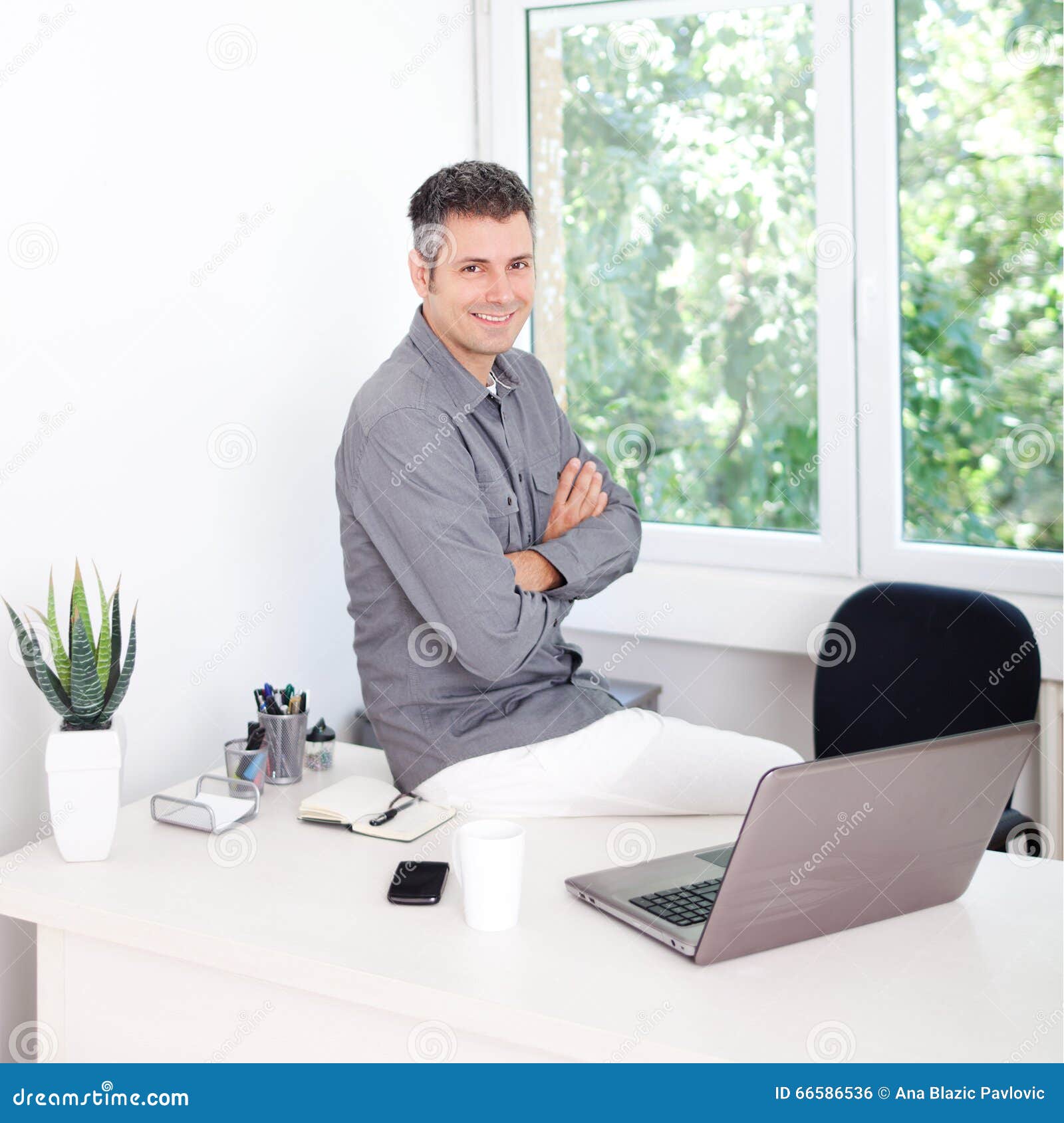 Young man at office stock photo. Image of notebook, businessman - 66586536