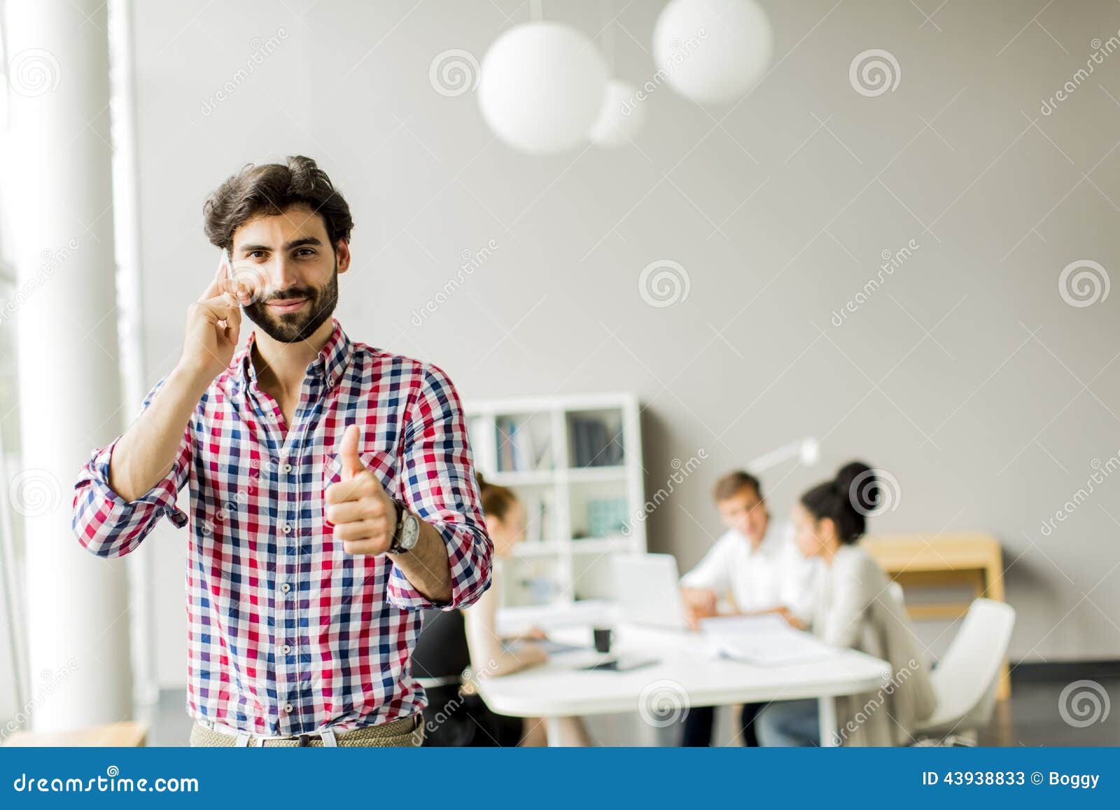 Young man in office stock image. Image of cell, beard - 43938833