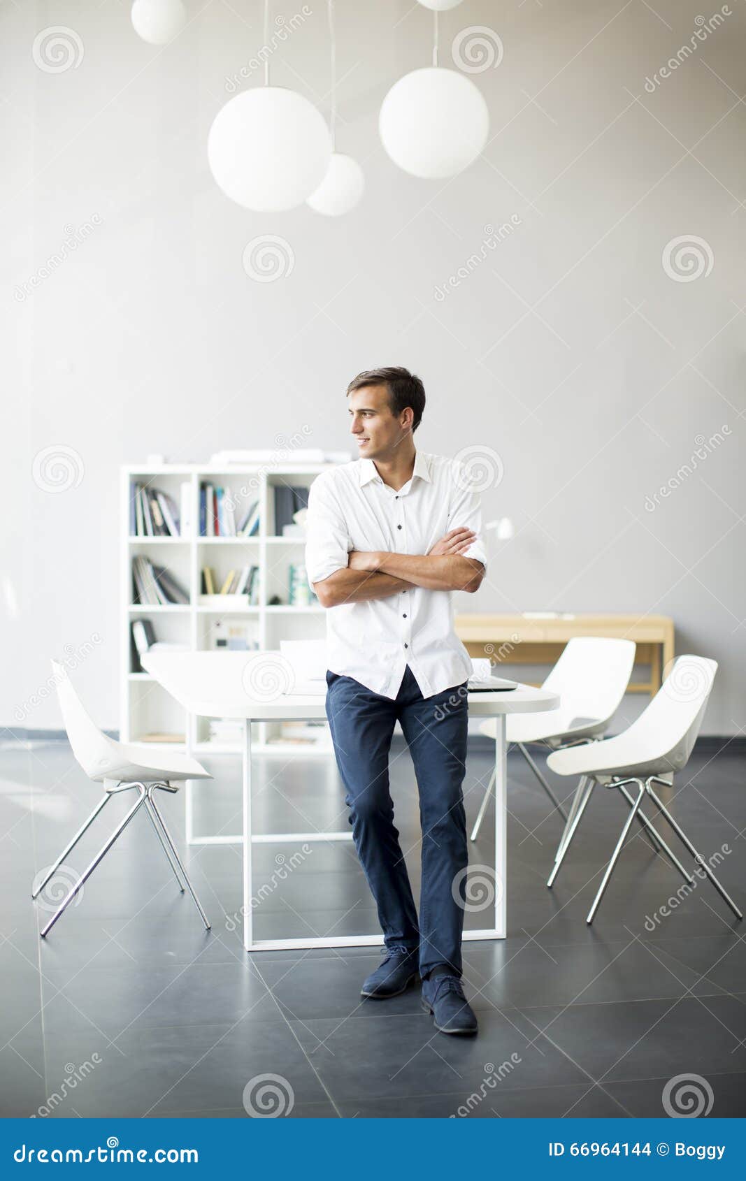 Young man in the office stock photo. Image of document - 66964144