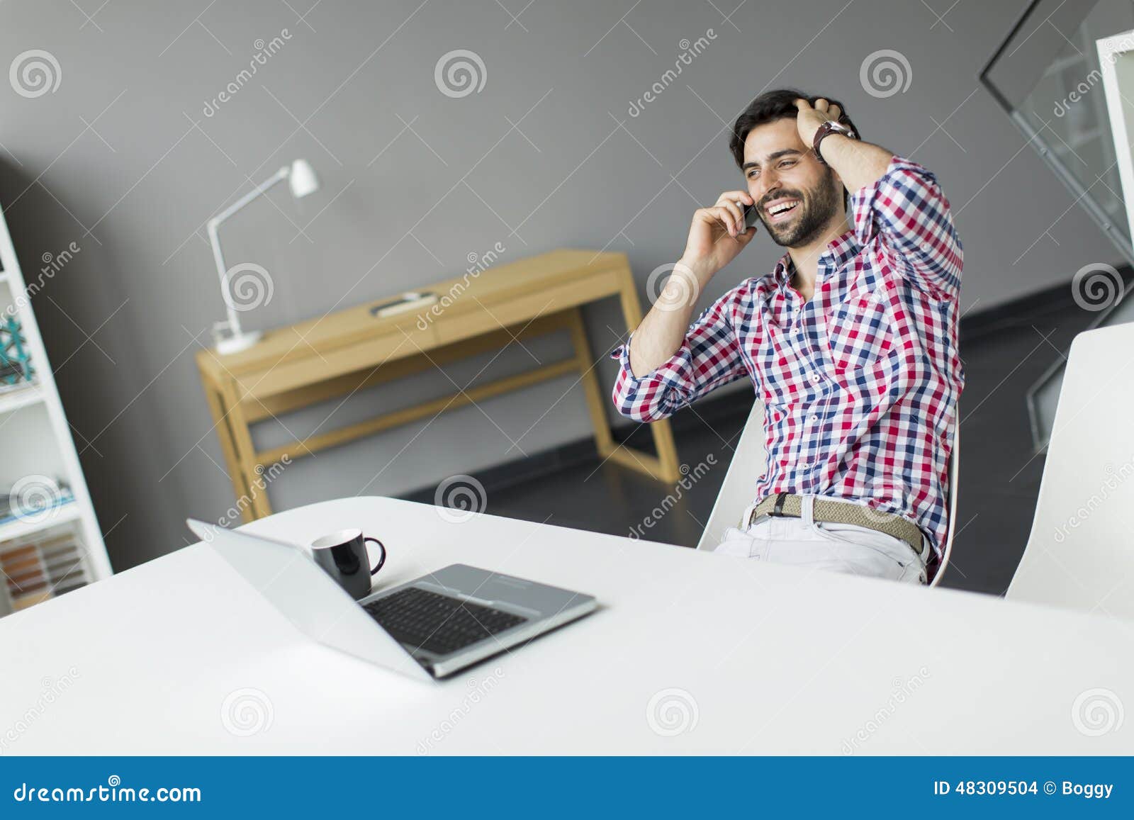 Young man in the office stock photo. Image of handsome - 48309504