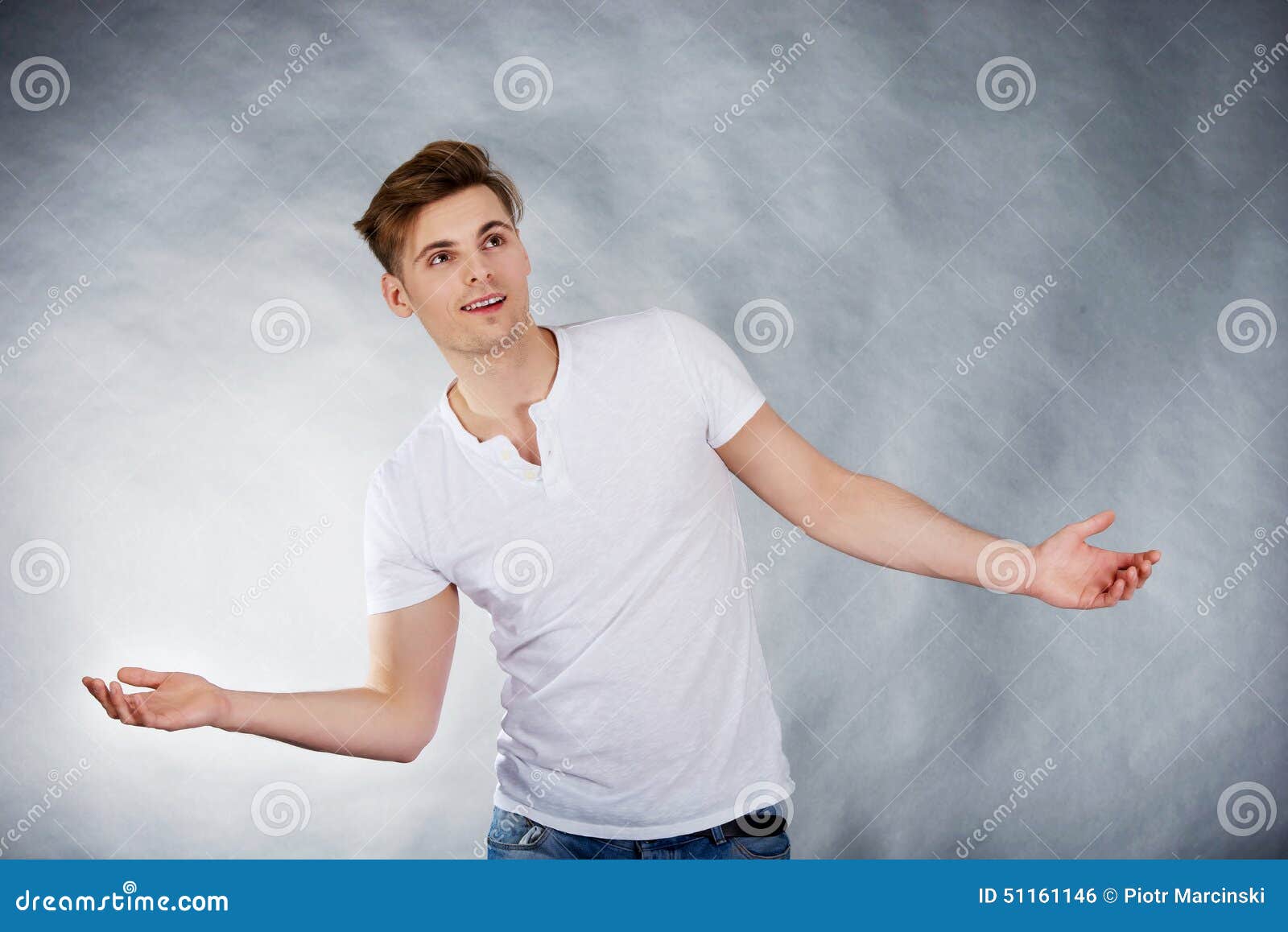 Young man with open hands. stock photo. Image of blank - 51161146