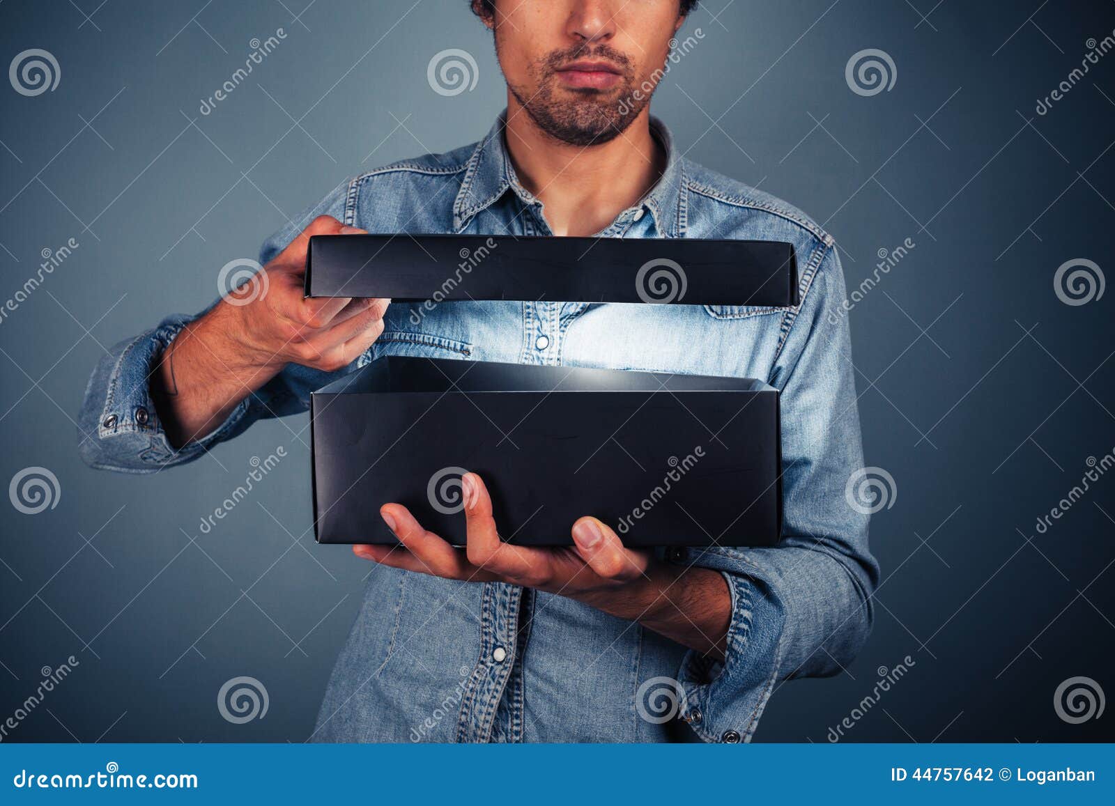 Young Man Opening an Exciting Box Stock Photo - Image of inside, young ...