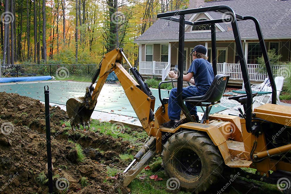 Young Man Operating Backhoe Stock Image - Image of backyard, backhoe ...