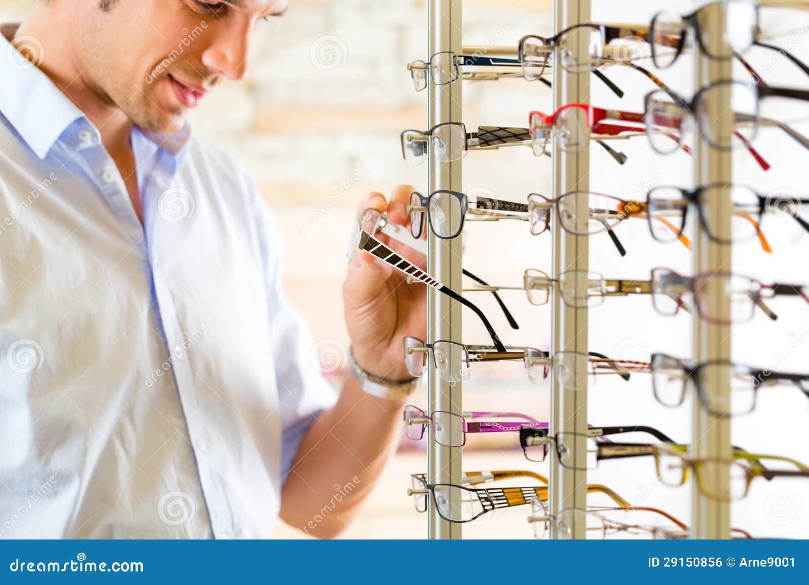 Young Man at Optician with Glasses Stock Photo - Image of happy ...