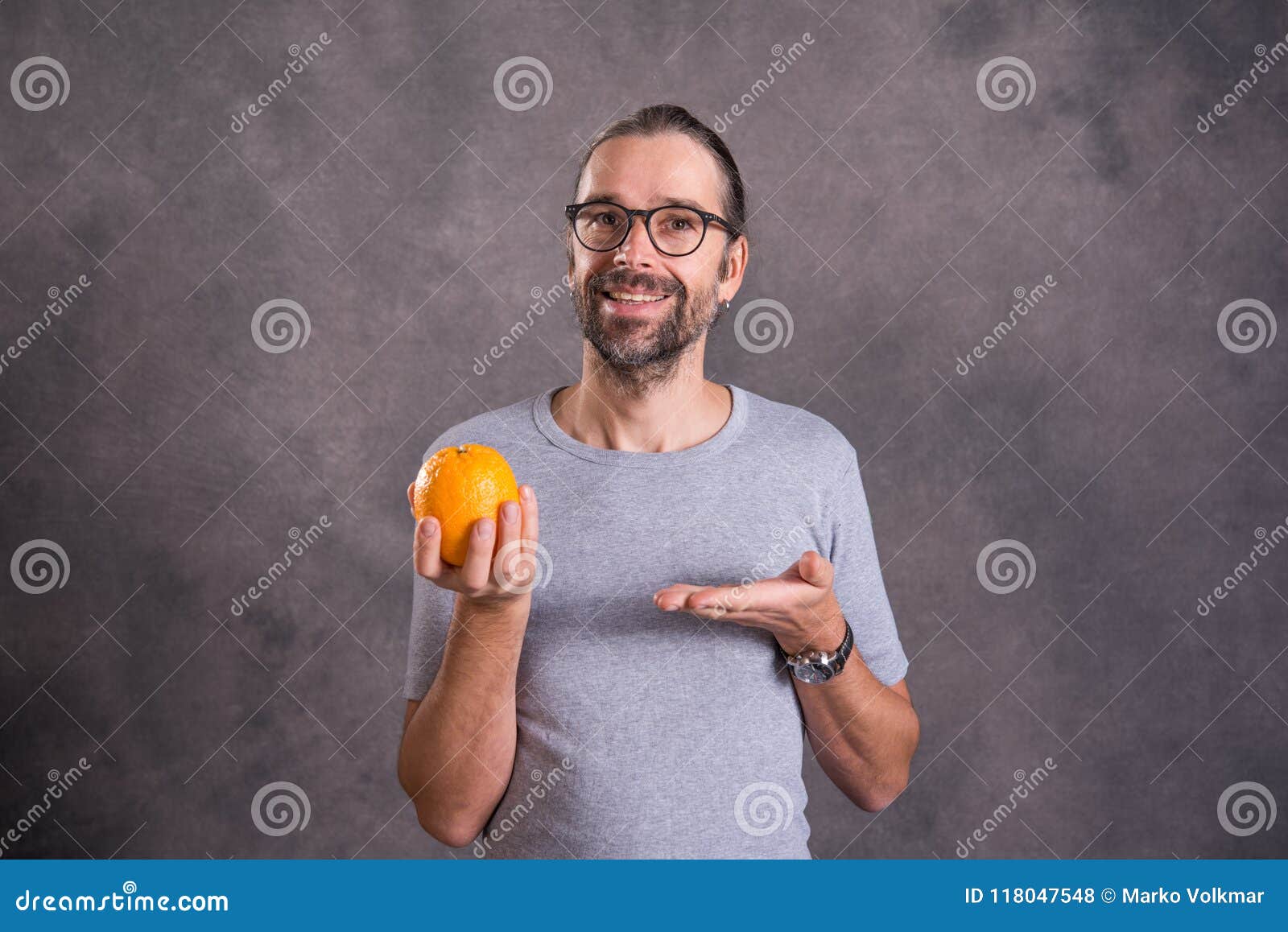 Young man with orange stock photo. Image of orange, white - 118047548