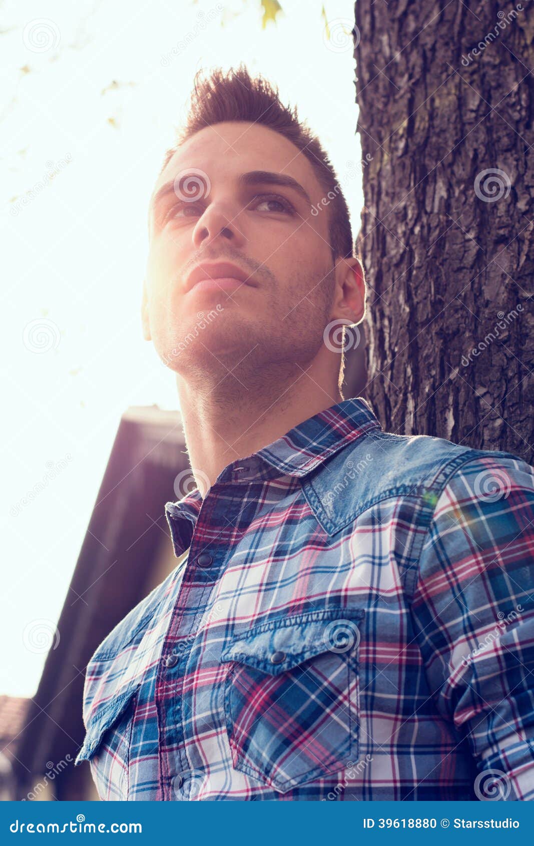 Young Man Outdoors at Sunset, with Sun Behind Him Stock Photo - Image ...