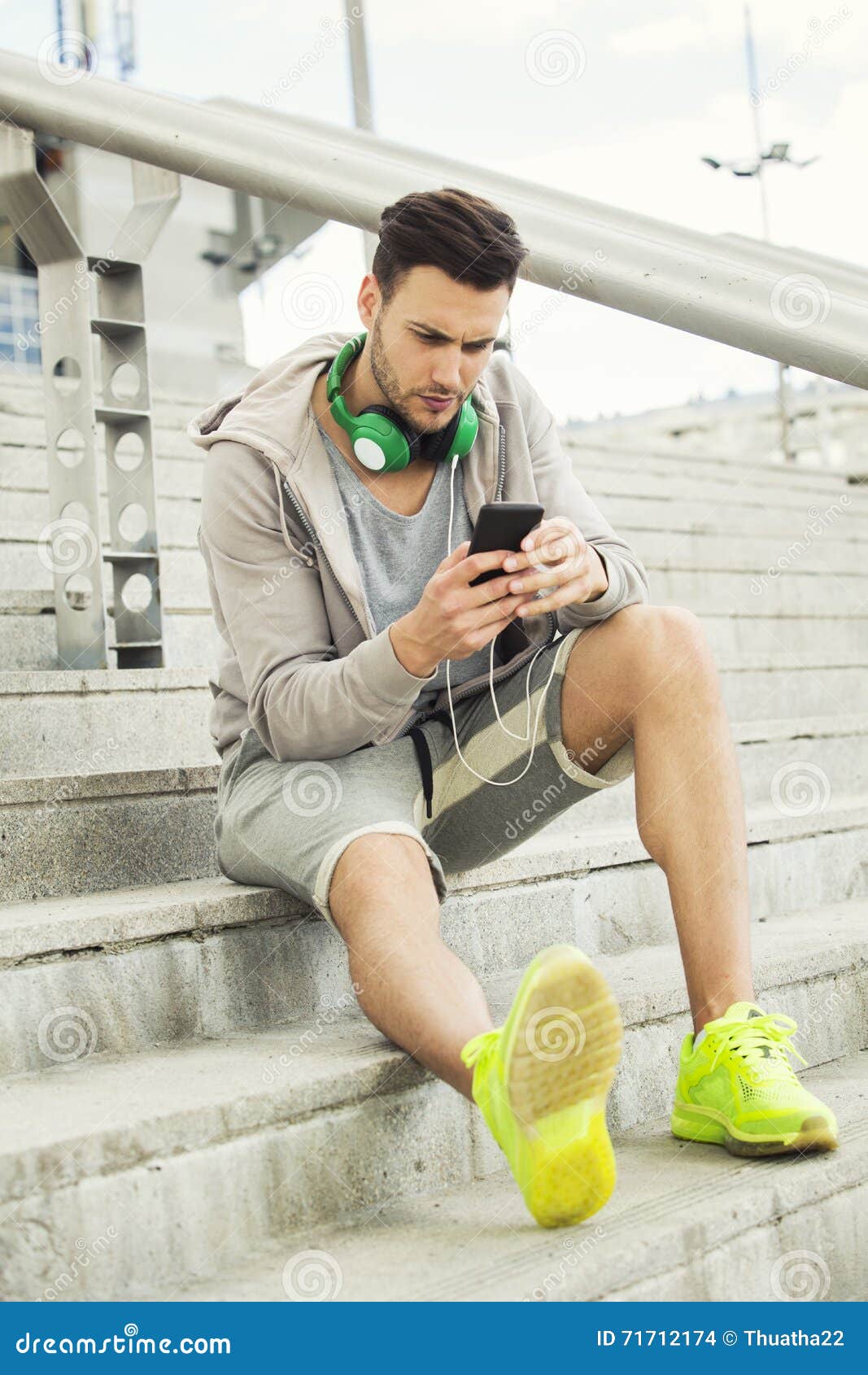 Young Man Outdoors Texting and Looking Worried Stock Photo - Image of ...