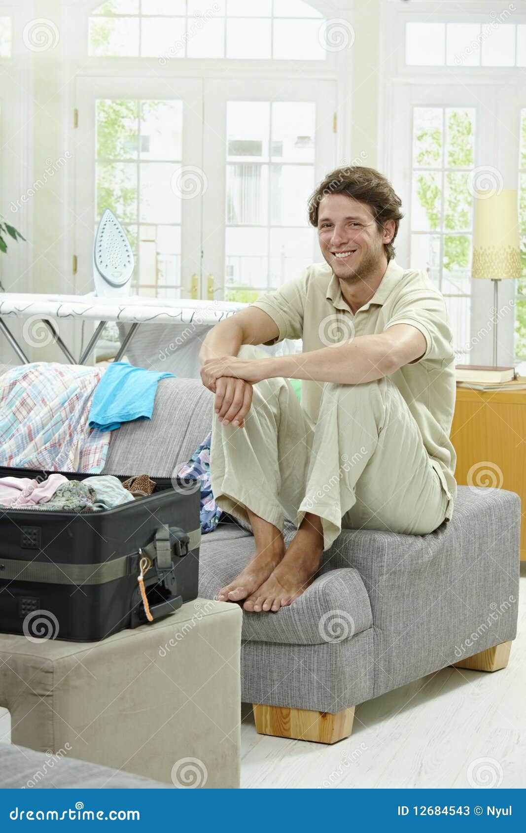 Young Man Packing for Vacation Stock Image - Image of alone, adult ...
