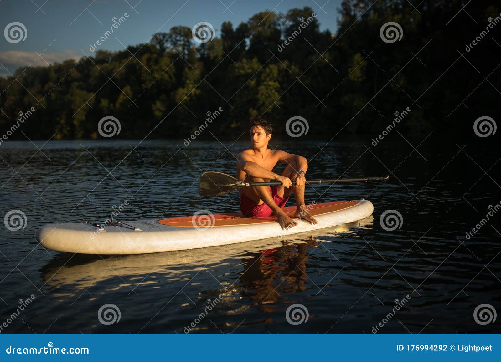 Young Man on a Paddle Board Stock Photo - Image of paddle, paddleboard ...